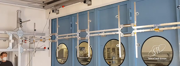 Multi-hinge solar array deployment mechanism for Copernicus on ZeroG robot